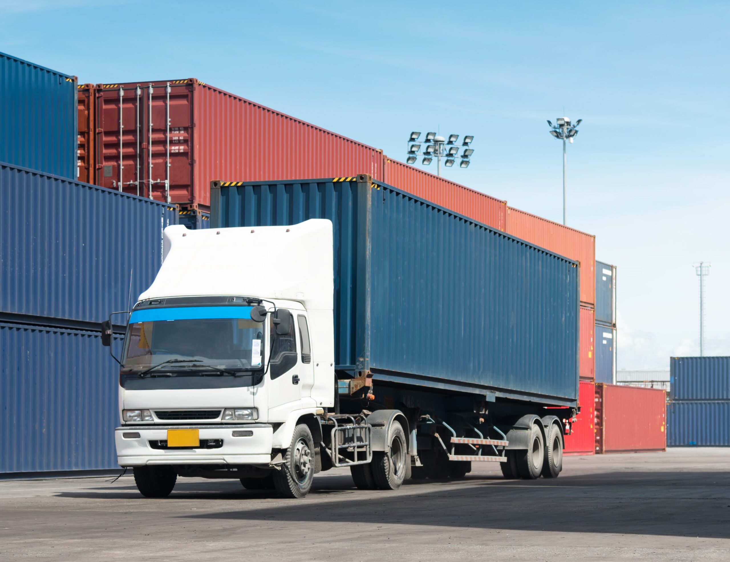 Truck with cargo container on road - Australian Container Removals